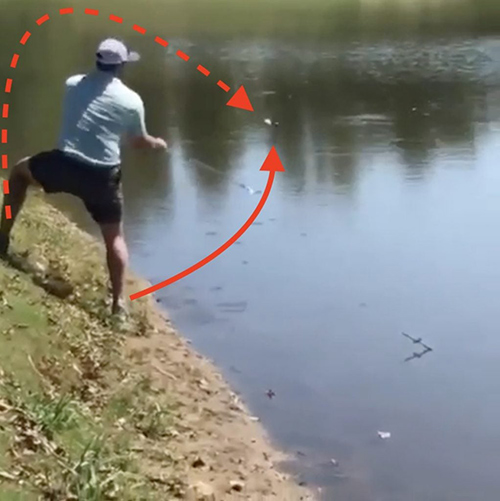 Watch this quick-thinking golfer hit a crazy lucky shot from water ...